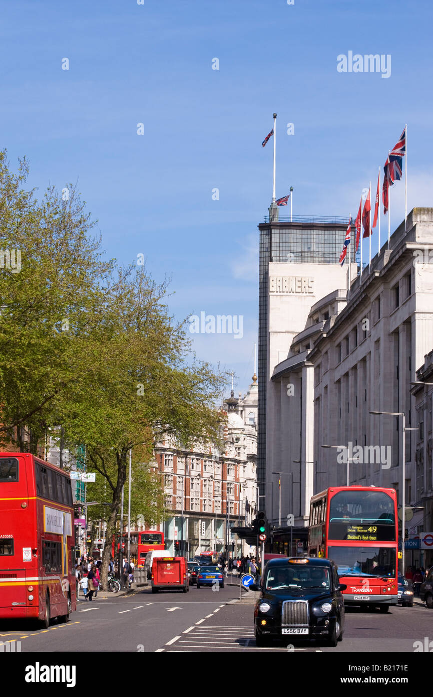 Traffic and architecture along Kensington High Street Kensington W8 ...