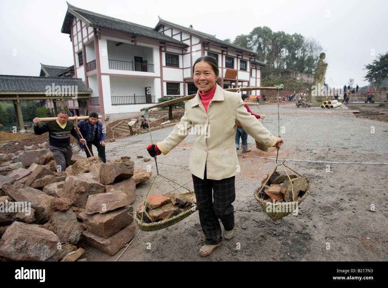 Woman at work building new tourist centre at Dazu Rock Carvings Mount ...