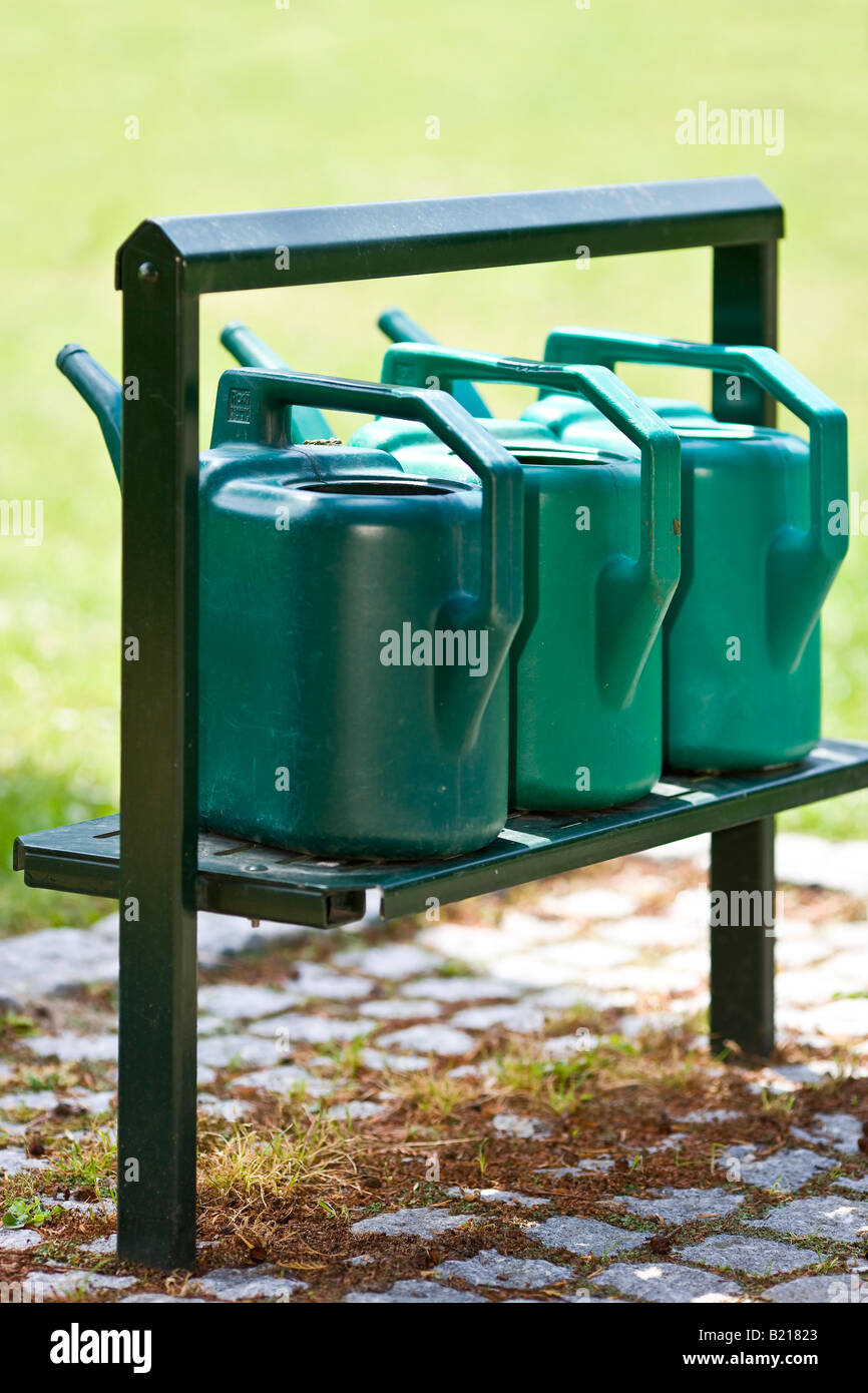 Four water jugs on the shelf Stock Photo - Alamy