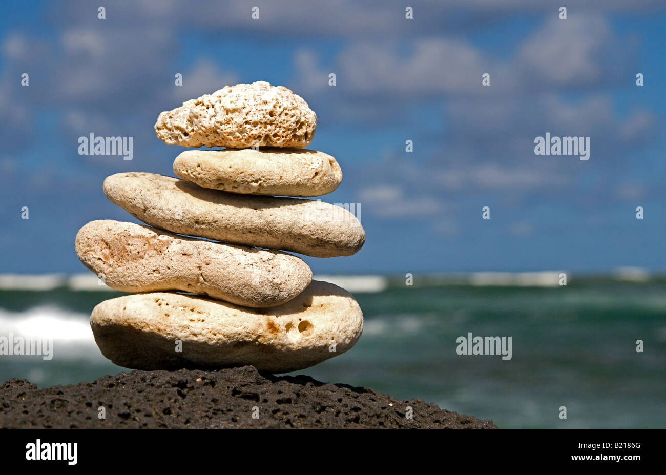 White coral rocks stacked by a meditating zen follower Stock Photo - Alamy