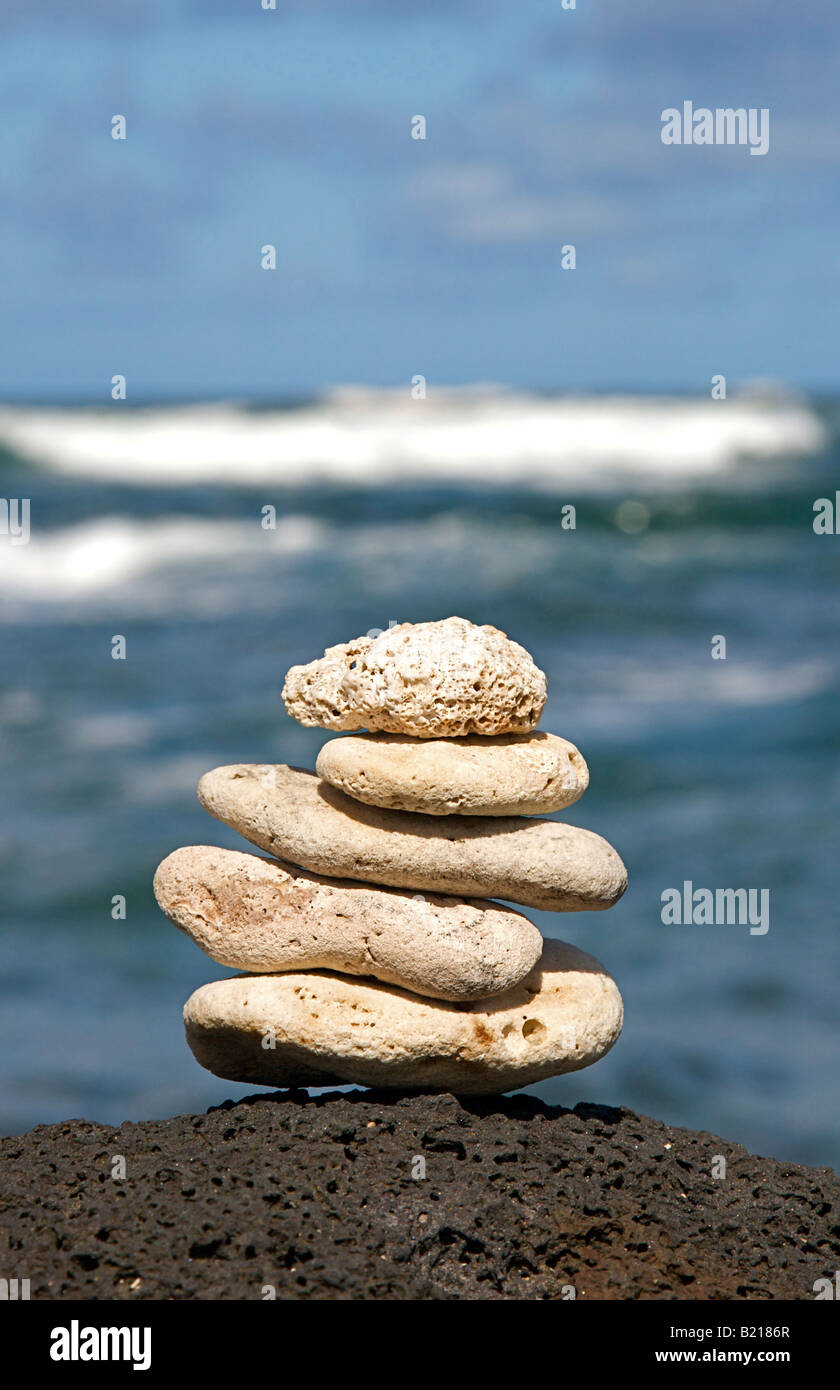 White coral rocks stacked by a meditating zen follower Stock Photo - Alamy