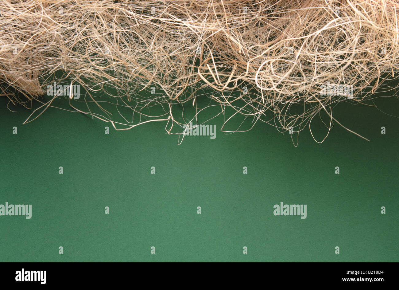 beige packing material over a green background Stock Photo - Alamy