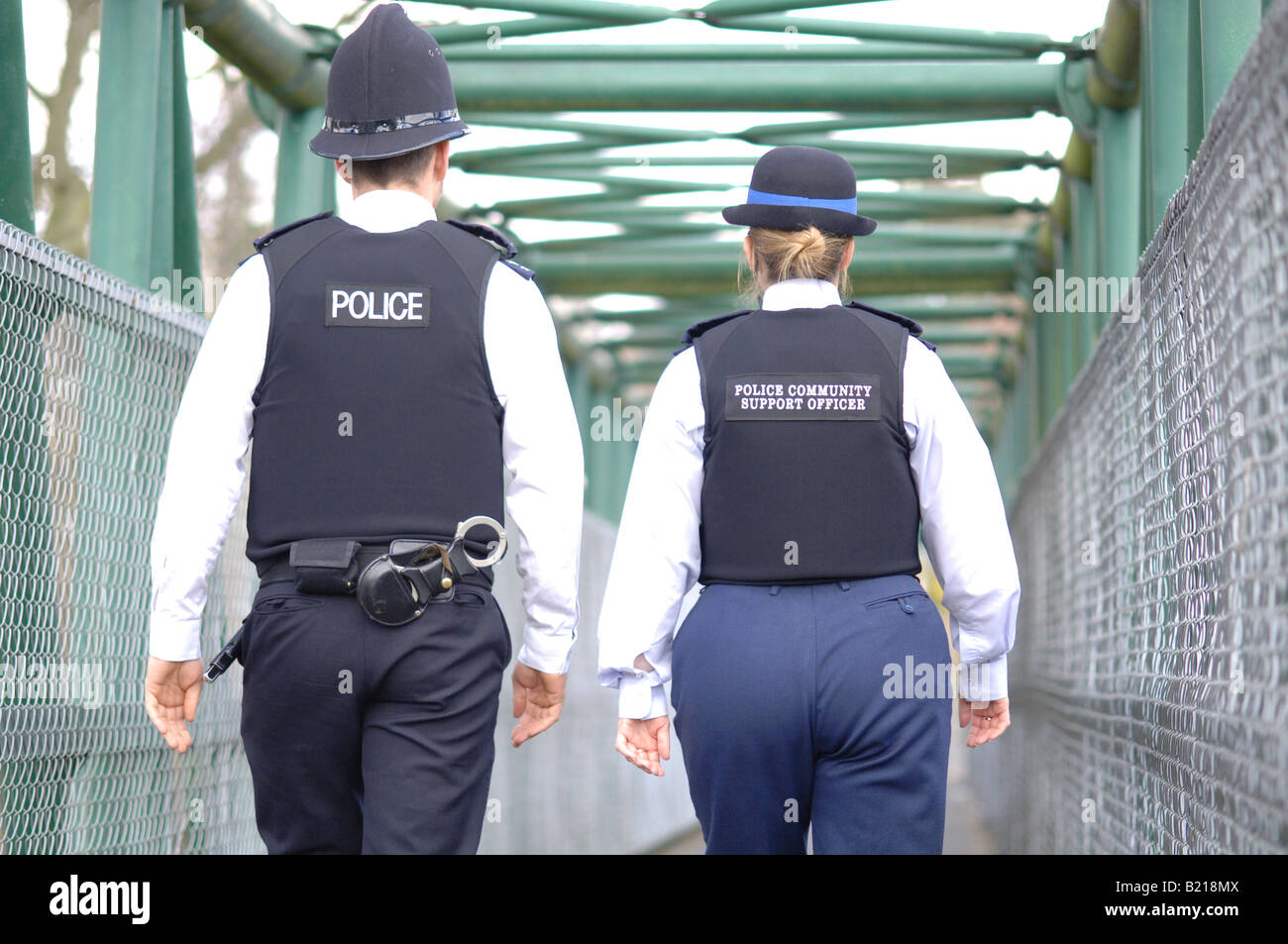 a police officer and Community Support Officer patrolling the streets ...