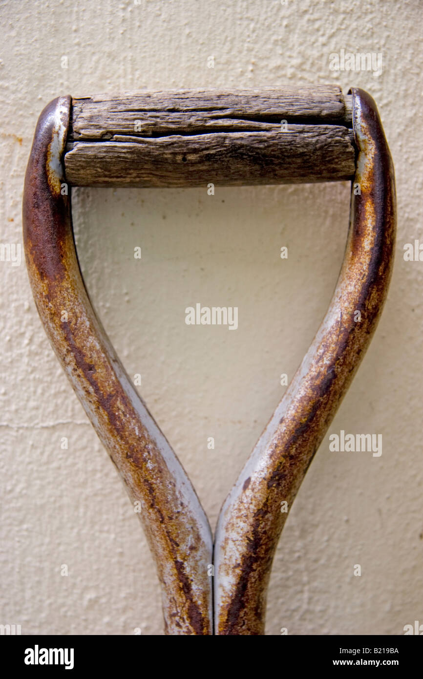 Handle of an old shovel showing signs of rust Stock Photo - Alamy