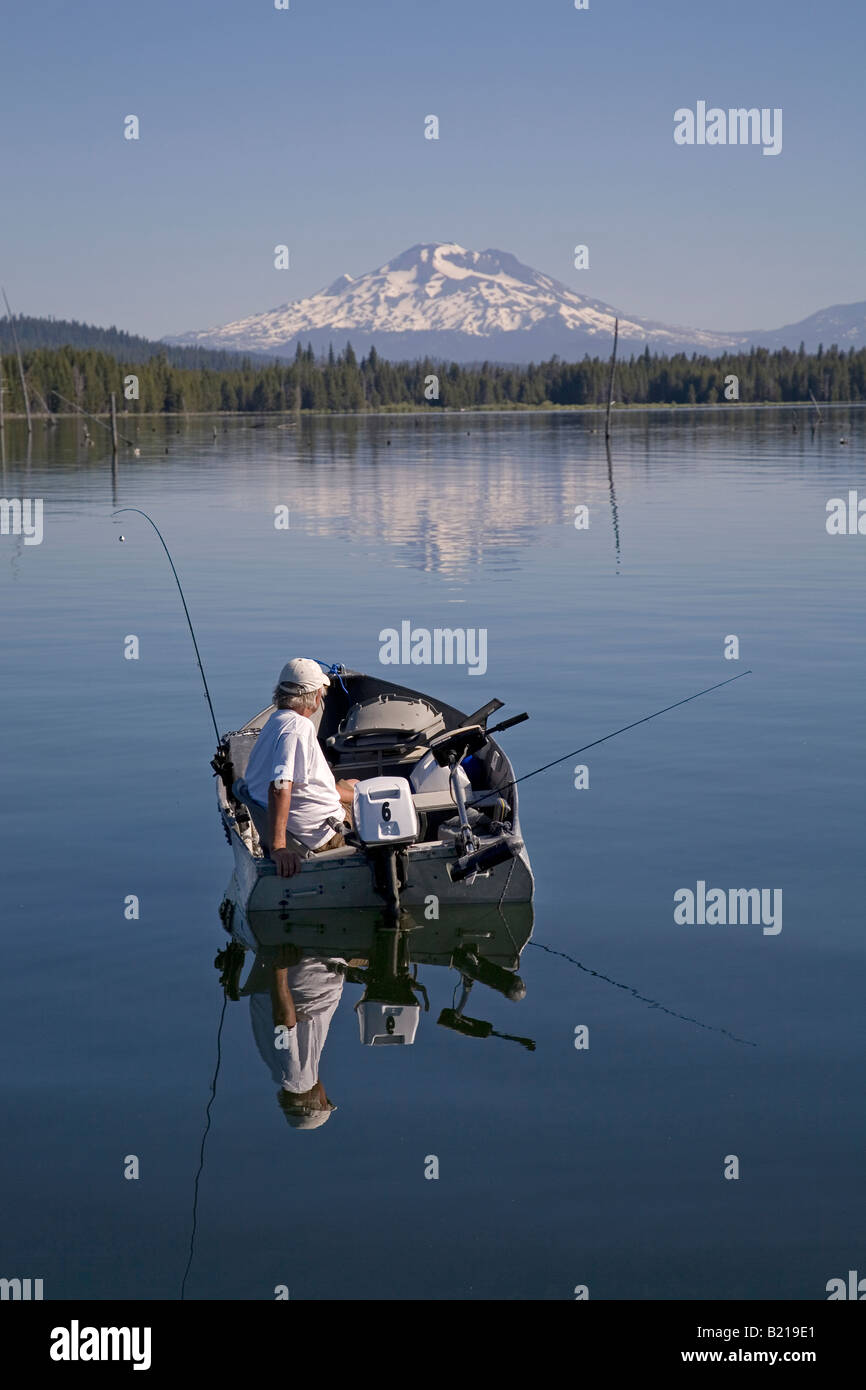 A fisherman fishes for rainbow and brown trout on a summer morning on ...