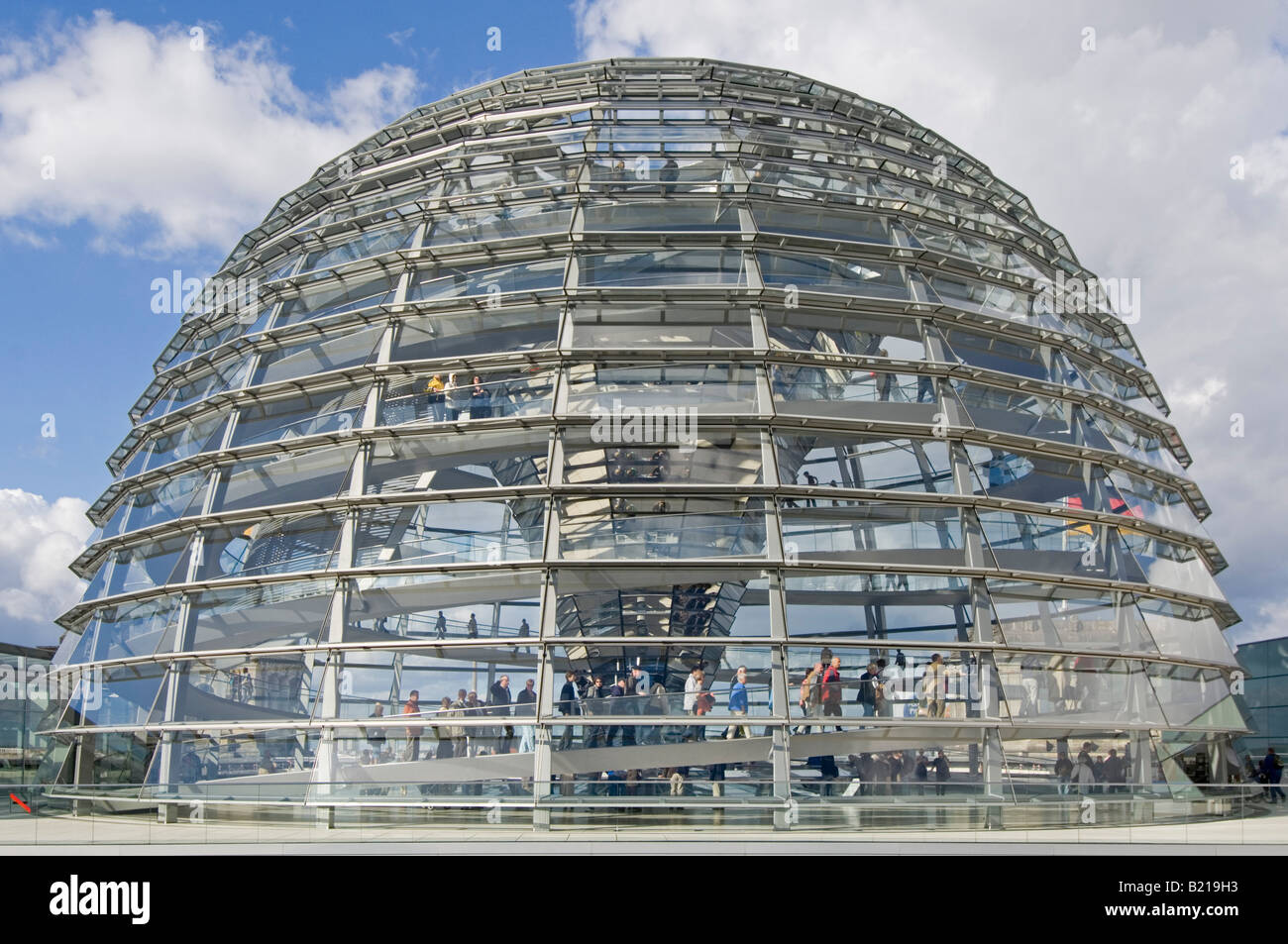 An exterior view of tourists inside the dome on top of the Reichstag ...