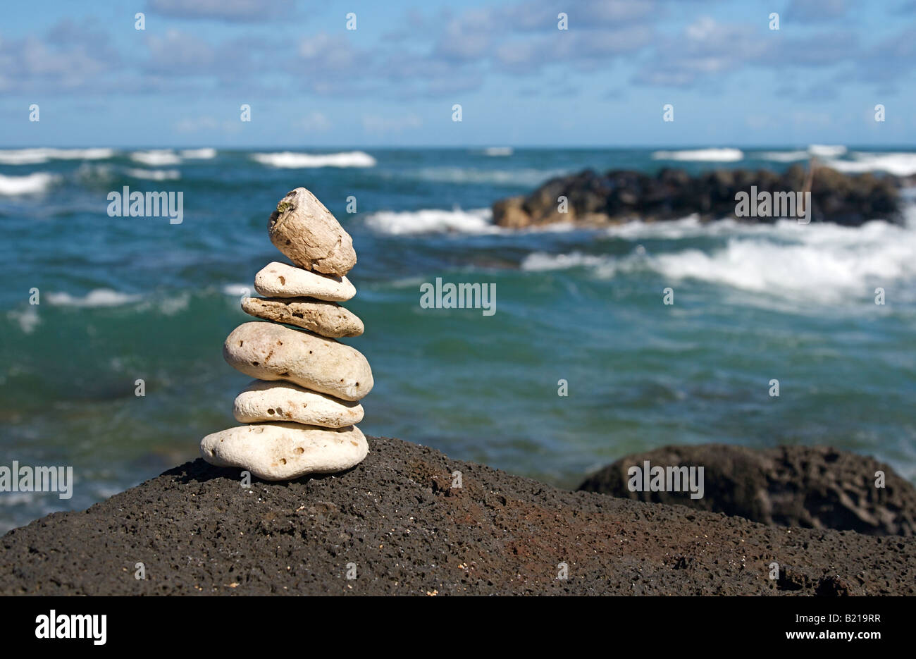 White coral rocks stacked by a meditating zen follower Stock Photo - Alamy
