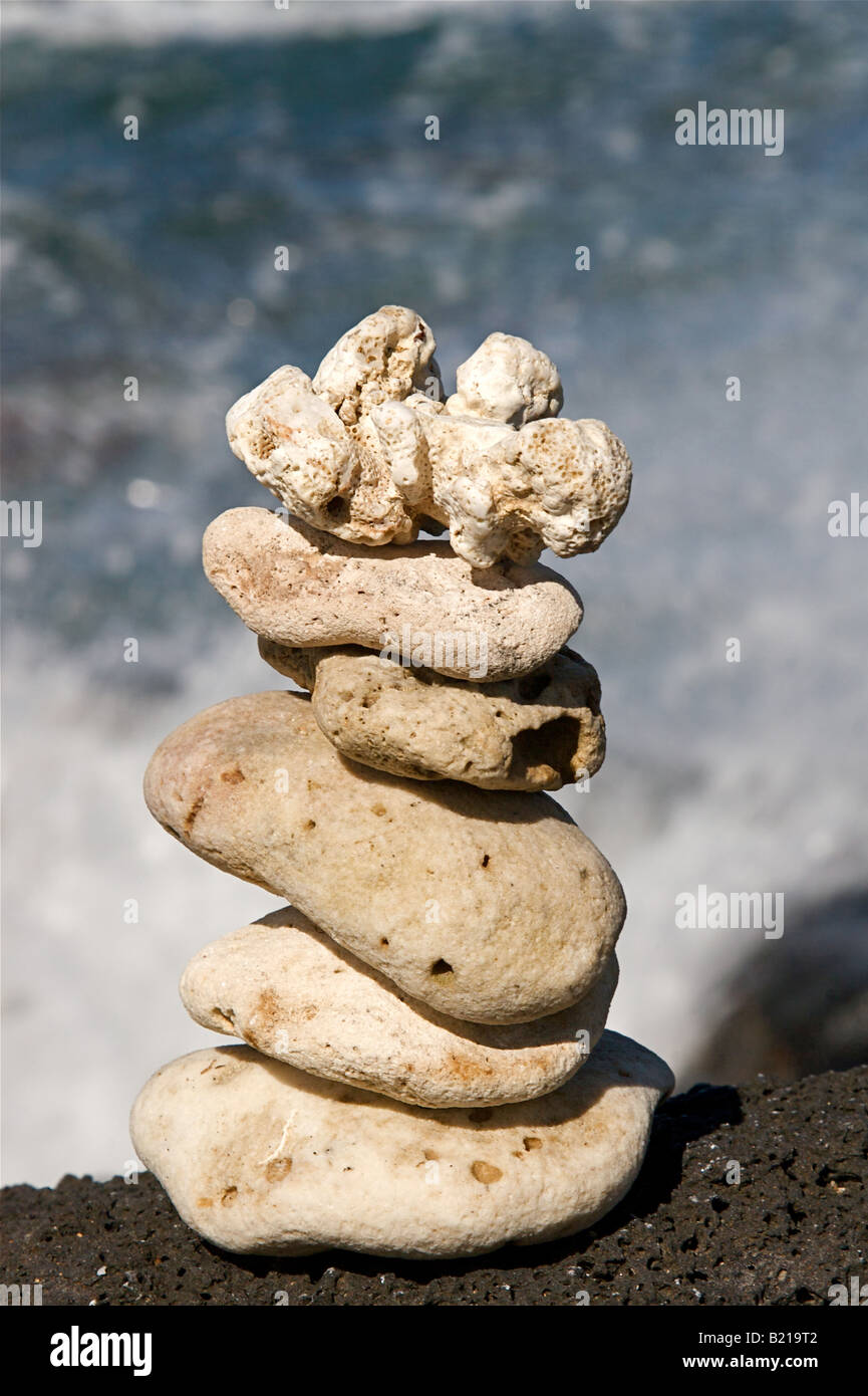 White coral rocks stacked by a meditating zen follower Stock Photo - Alamy