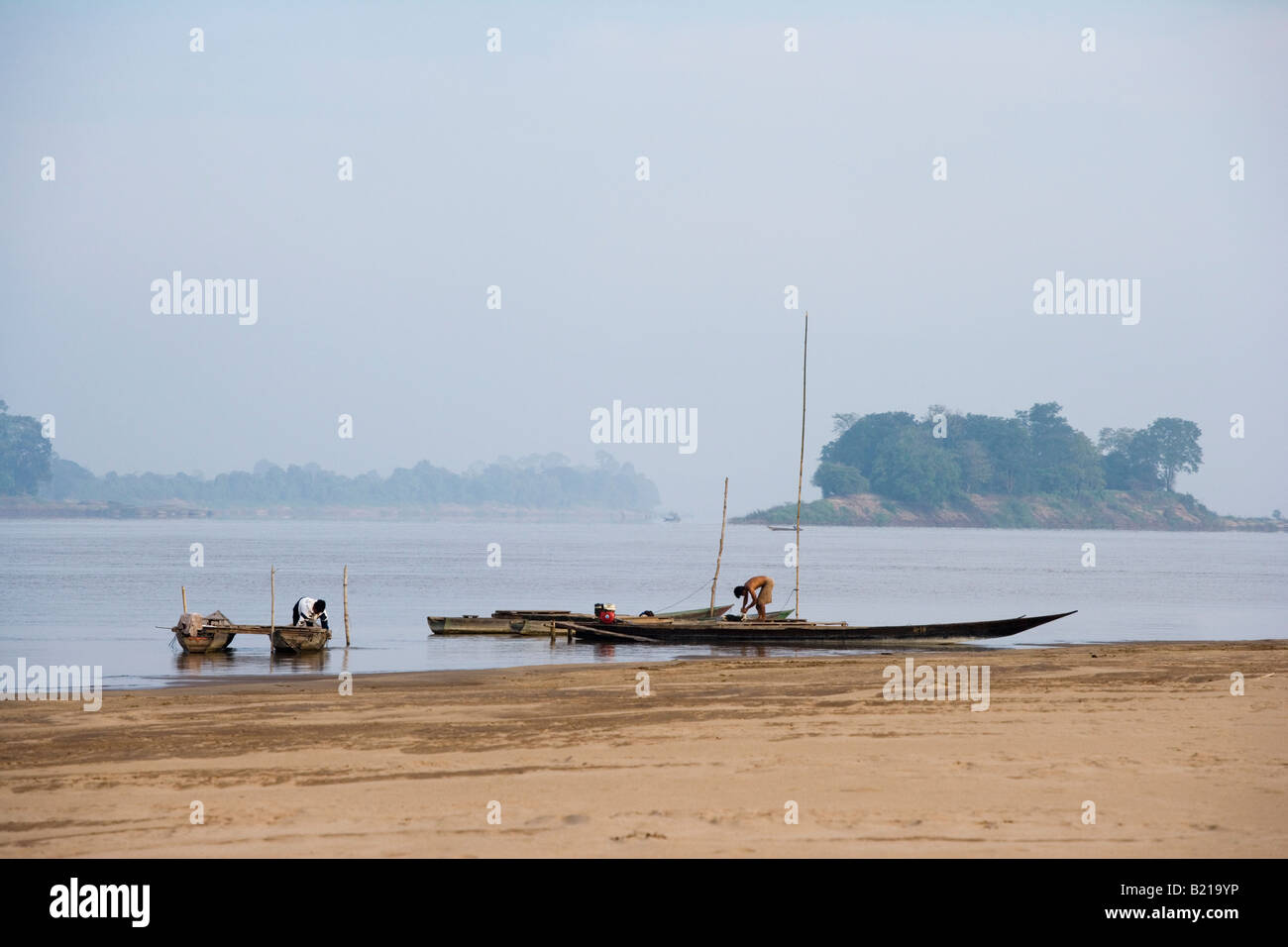 Fishermen prepare their nets in the morning on the Mekong River, Don ...