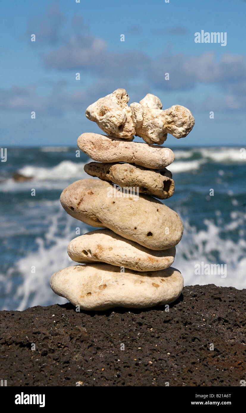 White coral rocks stacked by a meditating zen follower Stock Photo - Alamy