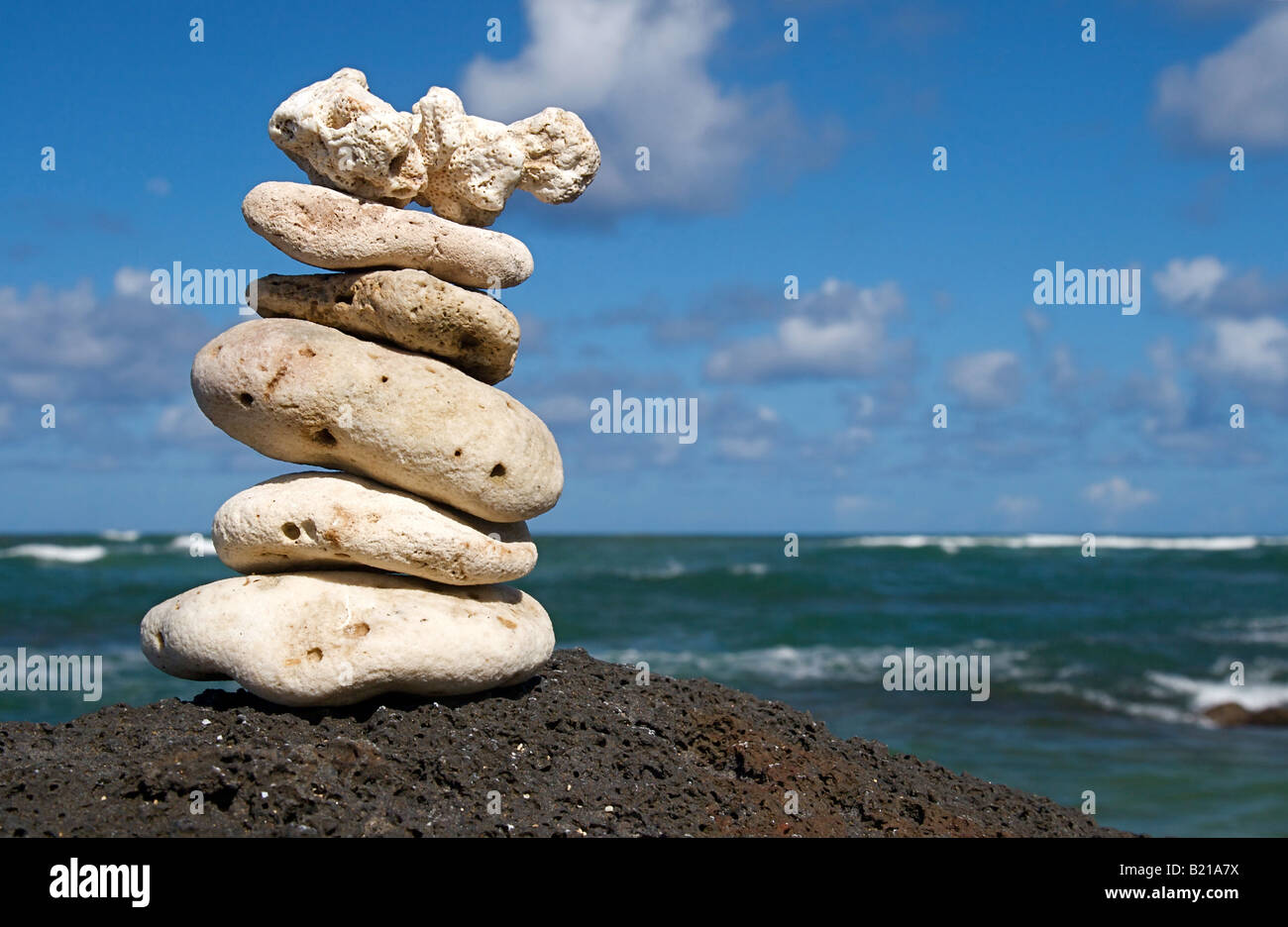 White coral rocks stacked by a meditating zen follower Stock Photo - Alamy
