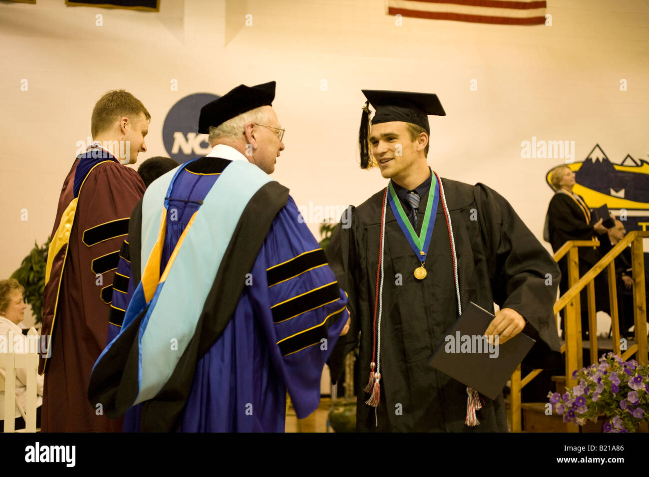 A happy male graduate from Massachusetts College of Liberal Arts in ...