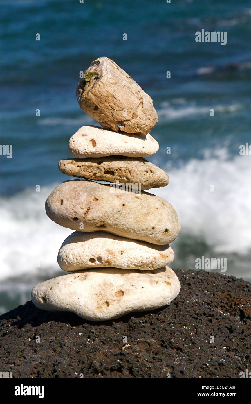 White coral rocks stacked by a meditating zen follower Stock Photo - Alamy