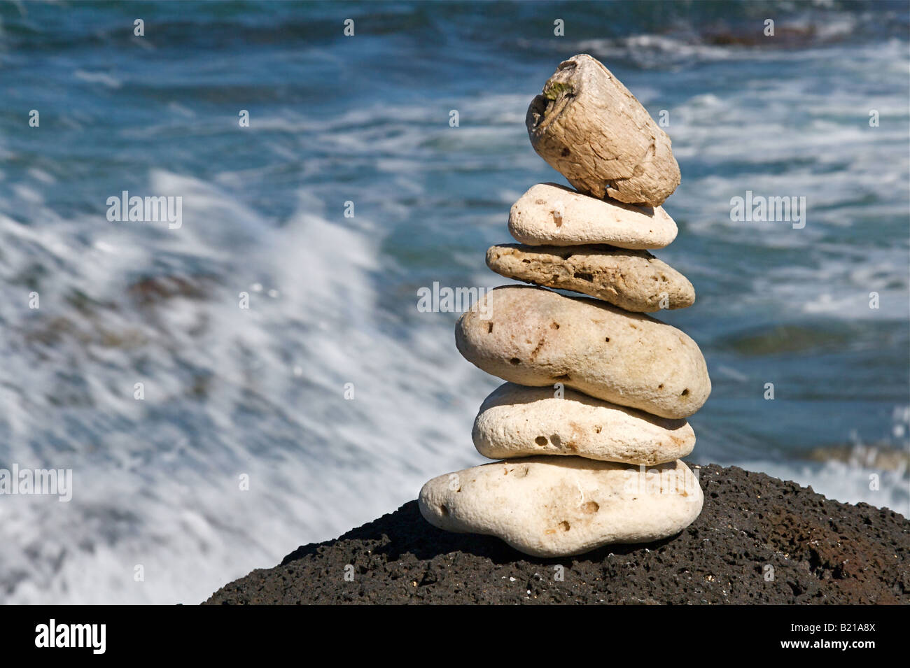 White coral rocks stacked by a meditating zen follower Stock Photo - Alamy