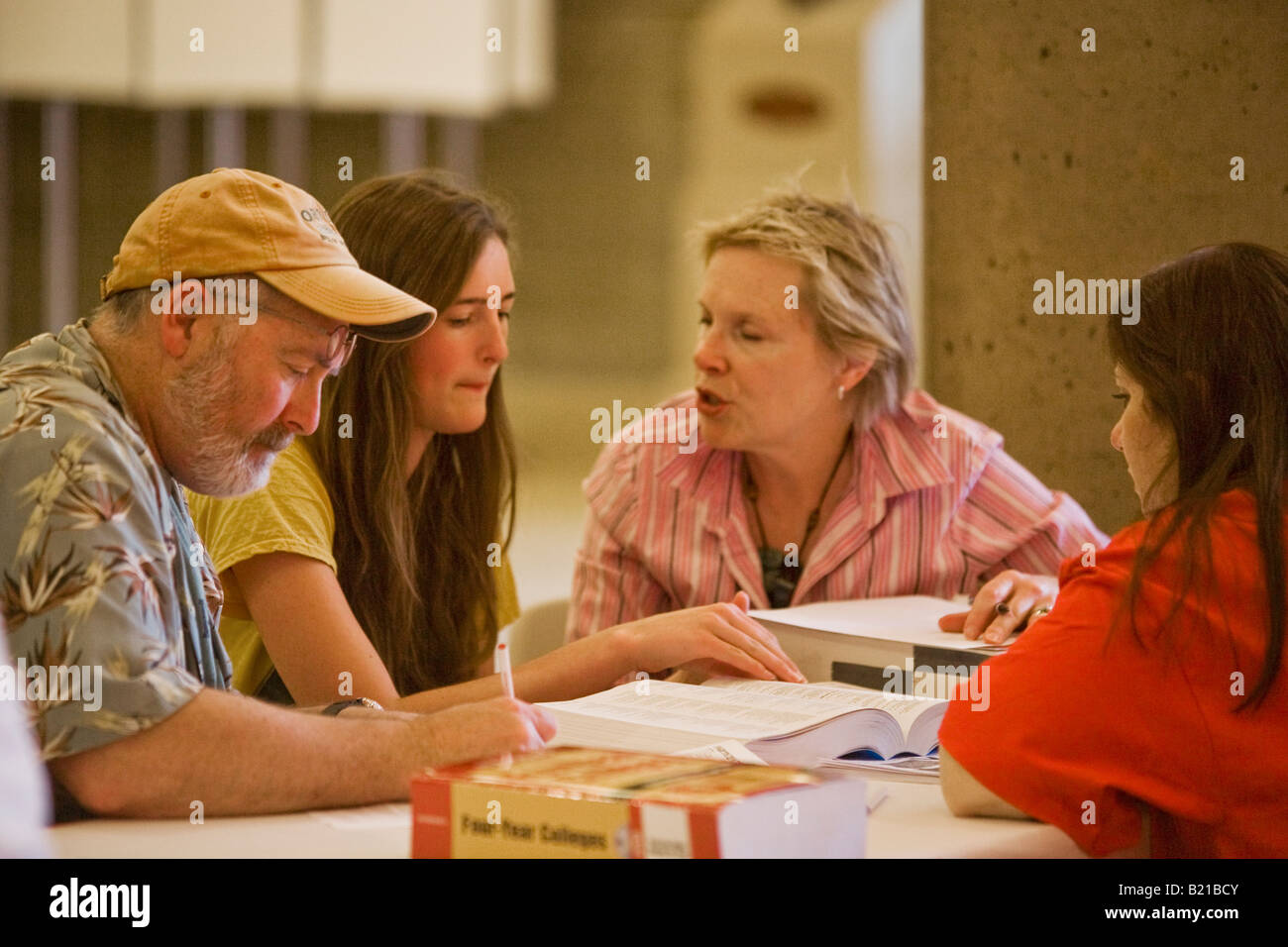 A high school student and her parents discuss their choice of colleges ...