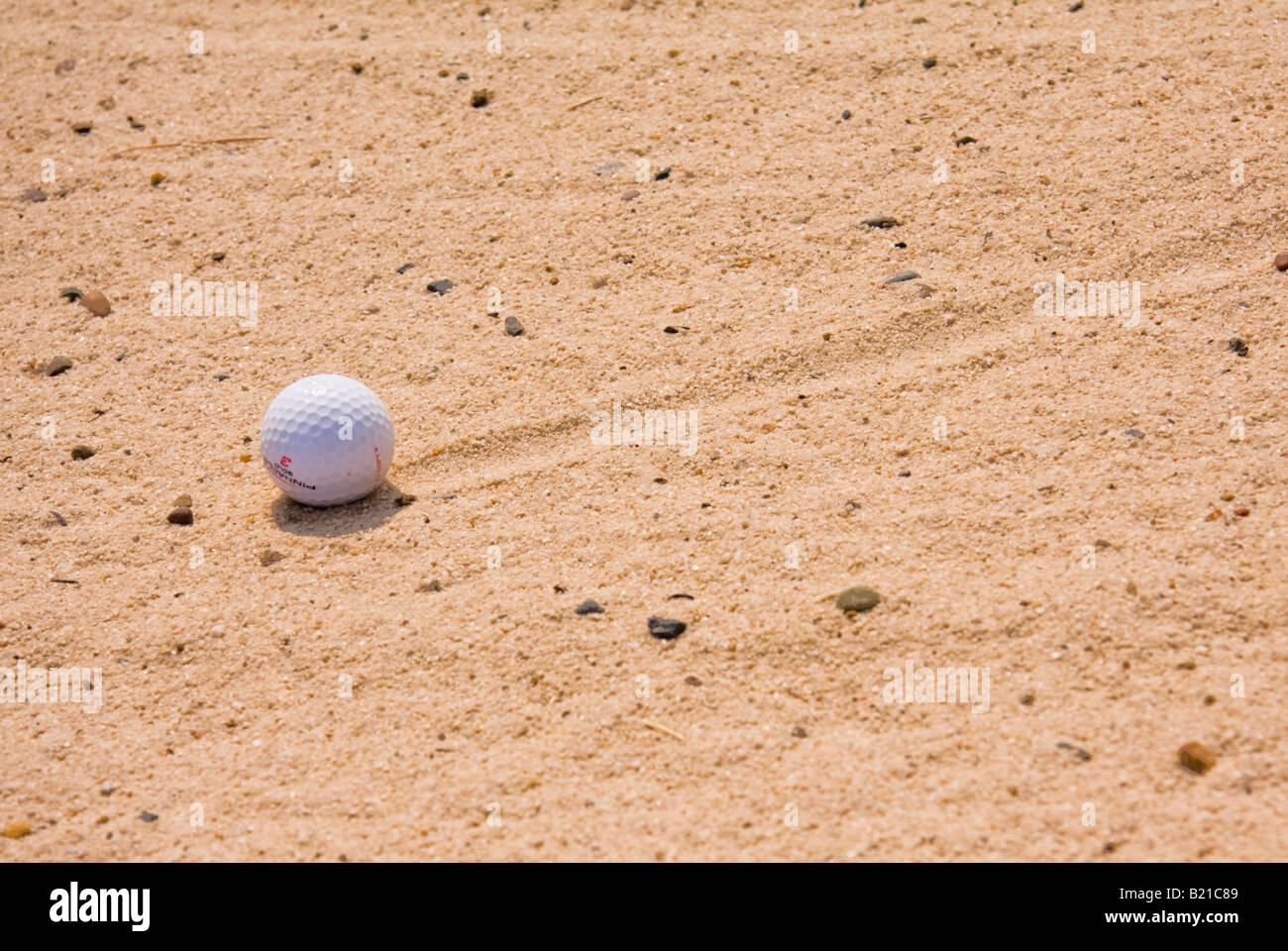 Golf Ball in Sand Trap Stock Photo - Alamy