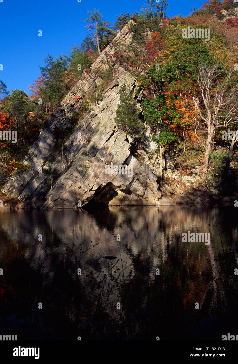 Anticline rock reflecting in the water autumn colors Stock Photo - Alamy