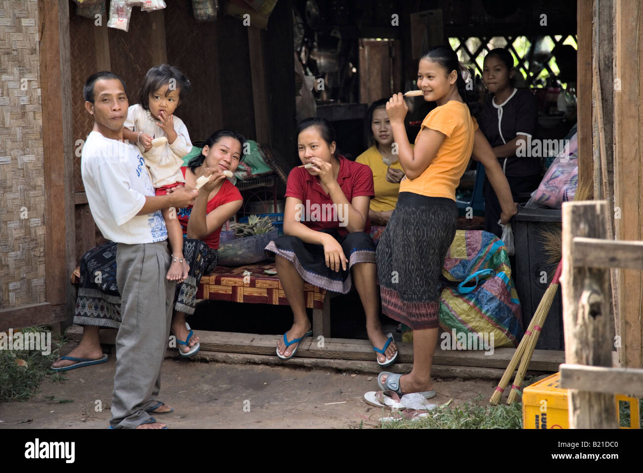 Lao family and friends enjoying ice cream at home, 4000 Islands, Mekong ...