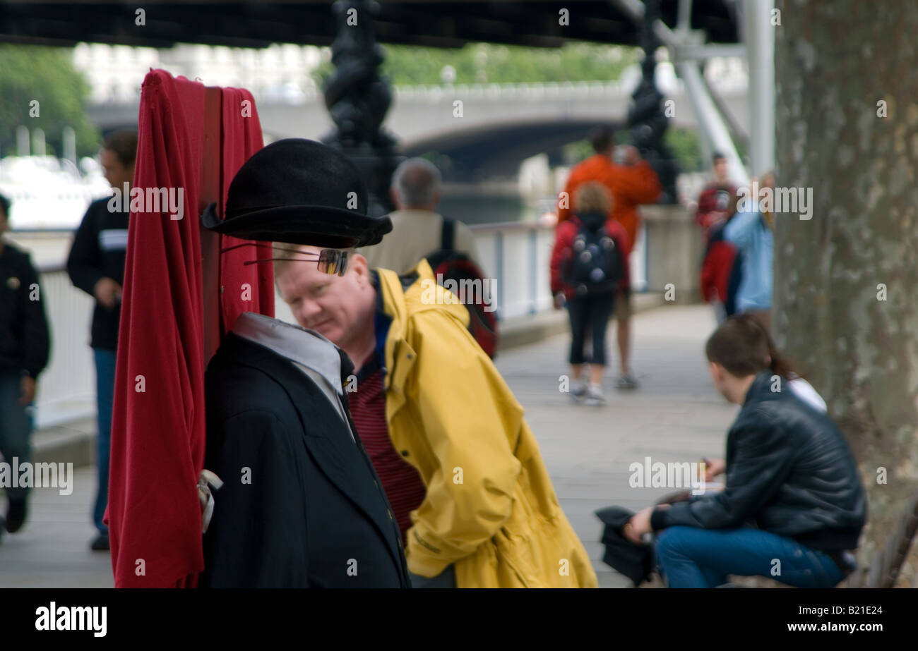 Double Vision London tourist looking through a headless street perfumer ...