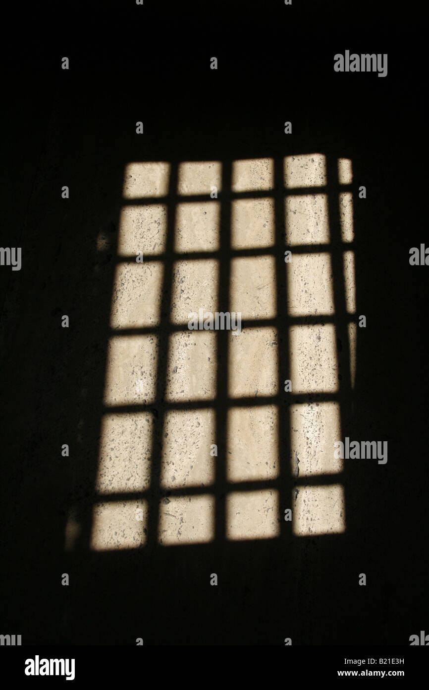 one high dark prison cell window with metal bars Stock Photo - Alamy
