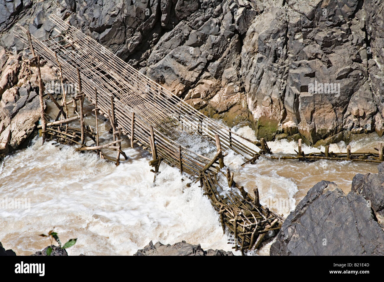 Wooden fish trap in the Mekong River, southern Laos Stock Photo - Alamy