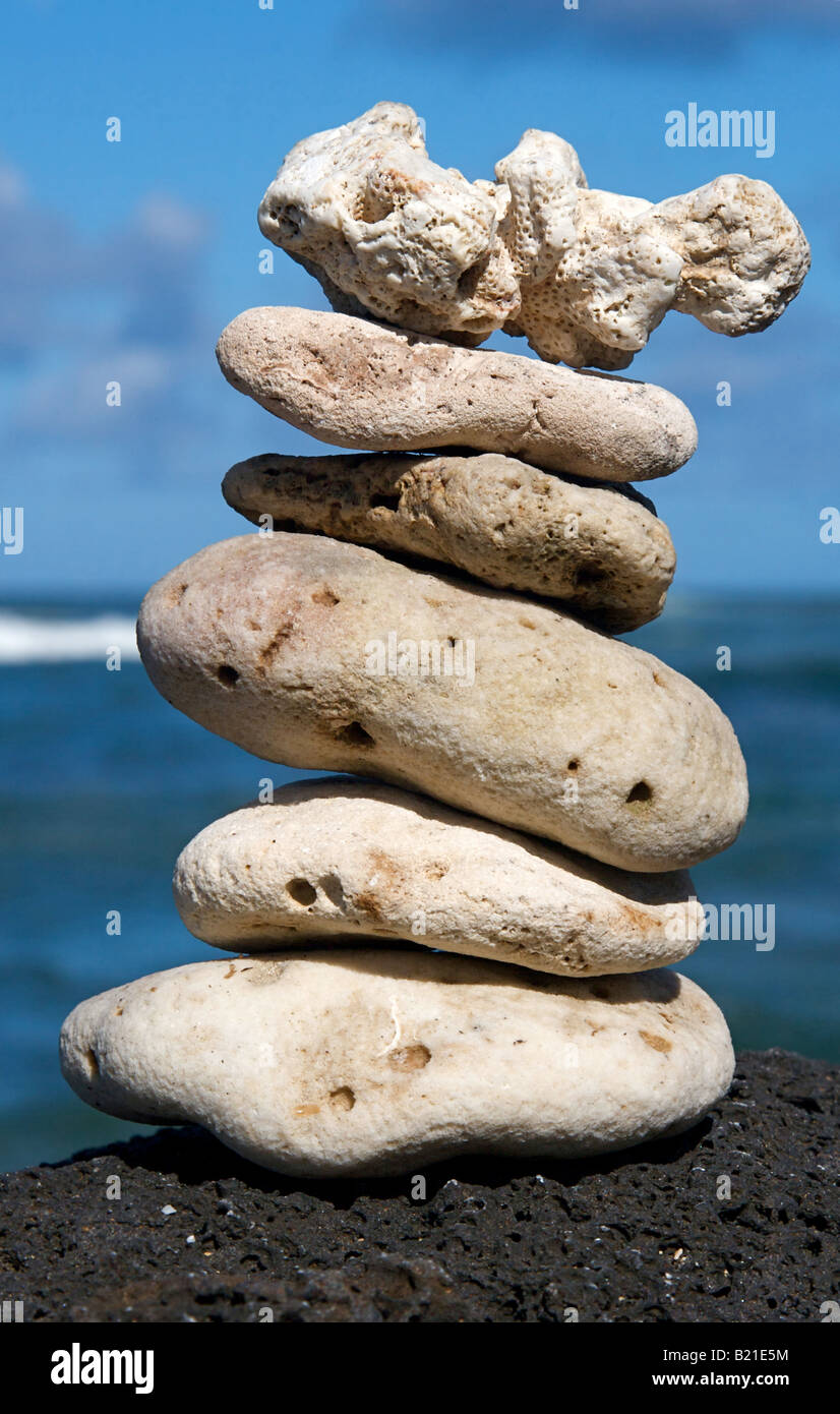 White coral rocks stacked by a meditating zen follower Stock Photo - Alamy