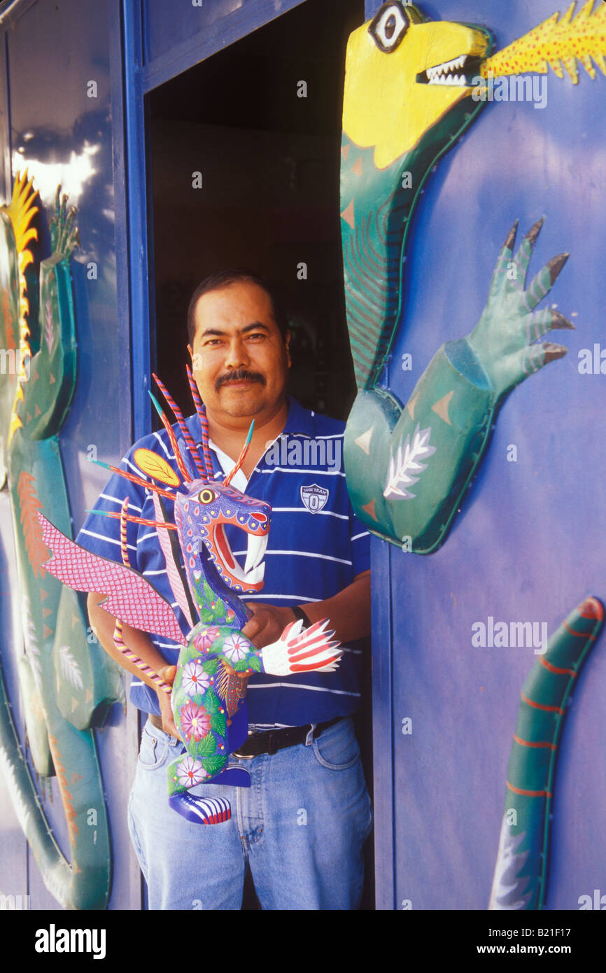 artist Joaquin Hernandez with a carved wooden alebrije San Martin ...