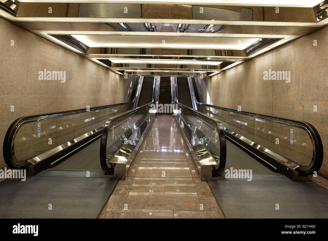 Modern building travelators and escalators Stock Photo - Alamy