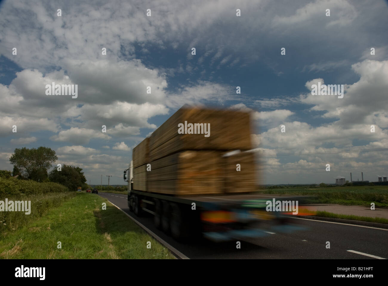 moving lorry truck carrying timber Stock Photo - Alamy