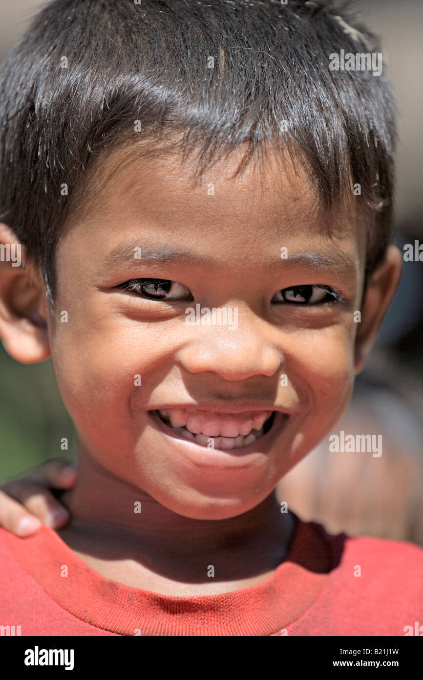 Lao boy smiles, southern Laos Stock Photo - Alamy