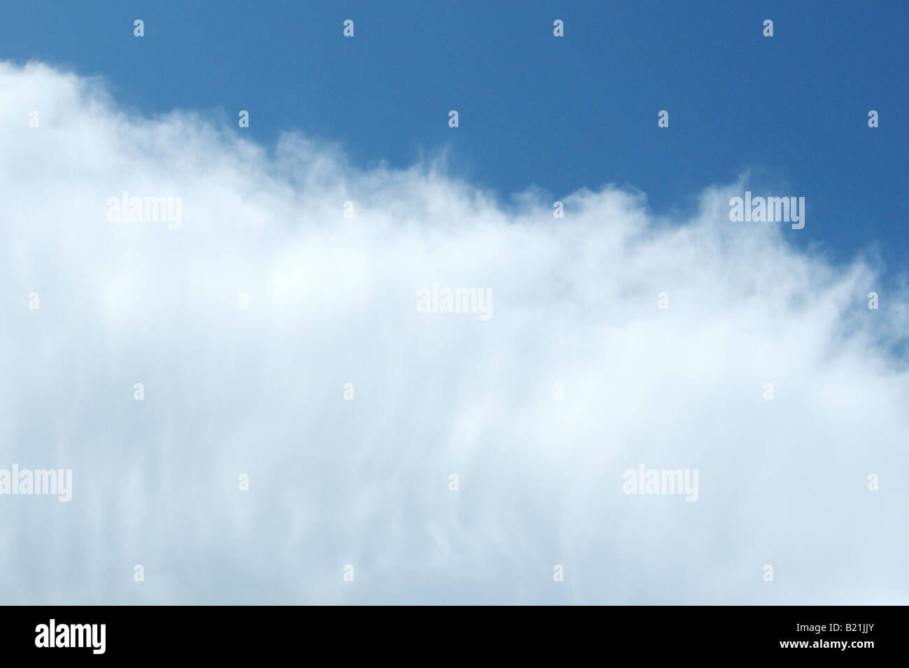 Wisps of white cloud like teazed wool brought about by high winds Stock ...