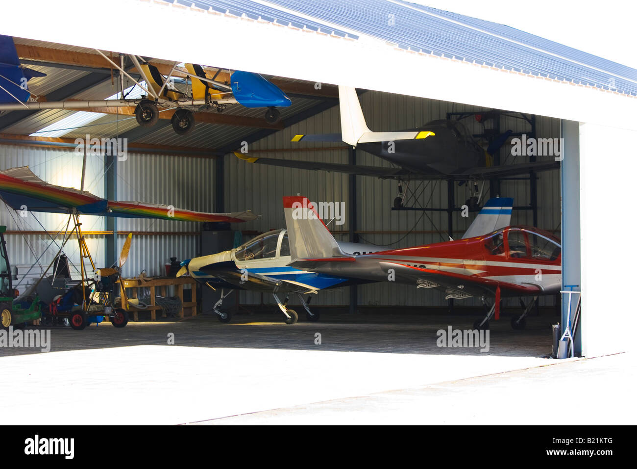 open hangar with ultralight airplanes inside Stock Photo - Alamy