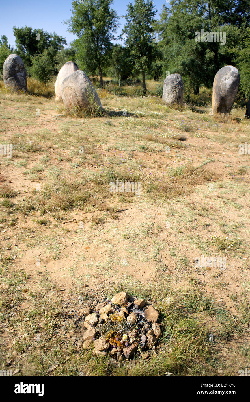 A fresh ritual hearth fire with votive offerings, proving that the site ...