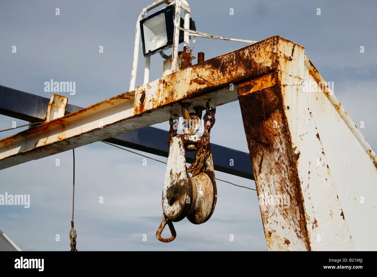 Big white industrial crane with rust Stock Photo - Alamy