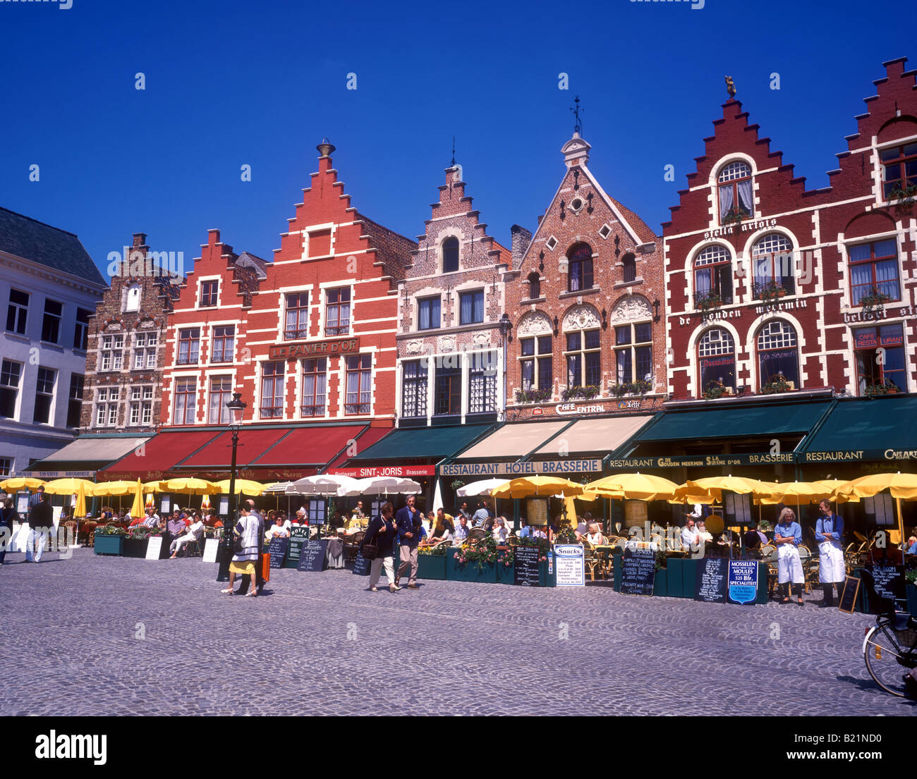 Bruges Colourful Market Square lined with cafes and restaurants Stock ...