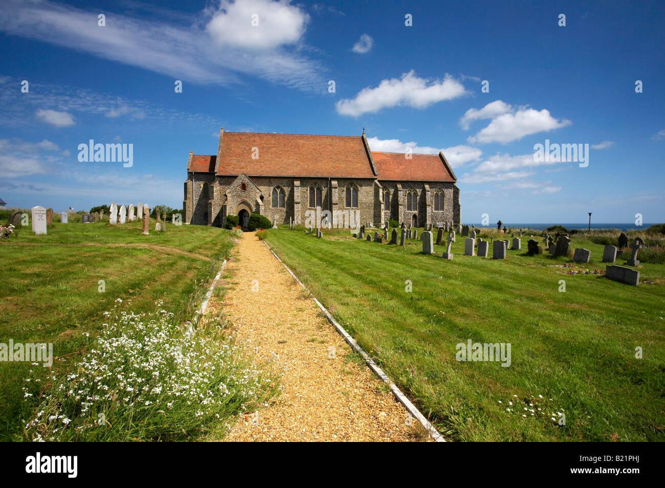 The village church of All Saints on a summers day in Mundesley Stock ...