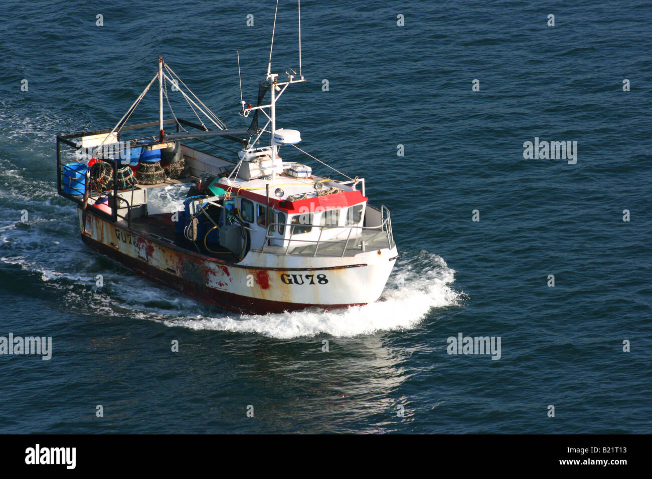 French fishing boat heading out of Cherbourg harbour into the English ...