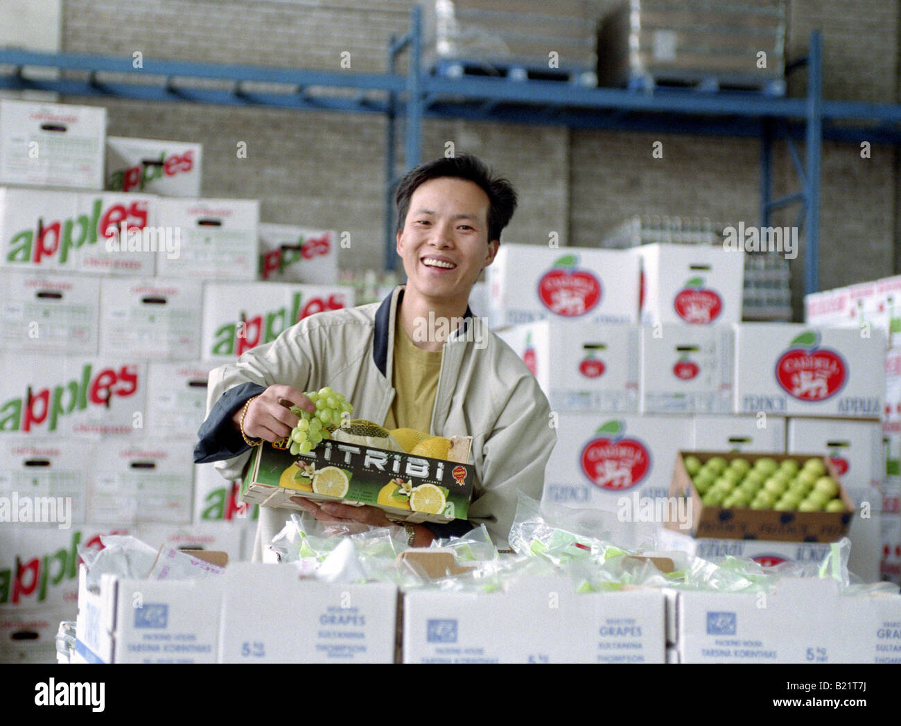 Choosing Produce at a Wholesale Fruitier Stock Photo - Alamy