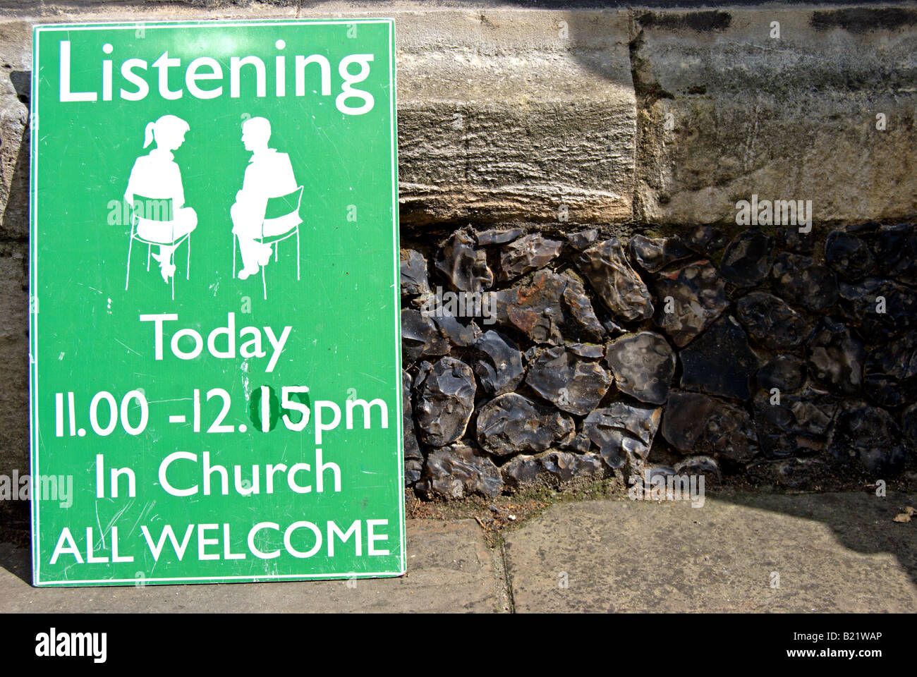 green sign advertising the listening service available inside all ...