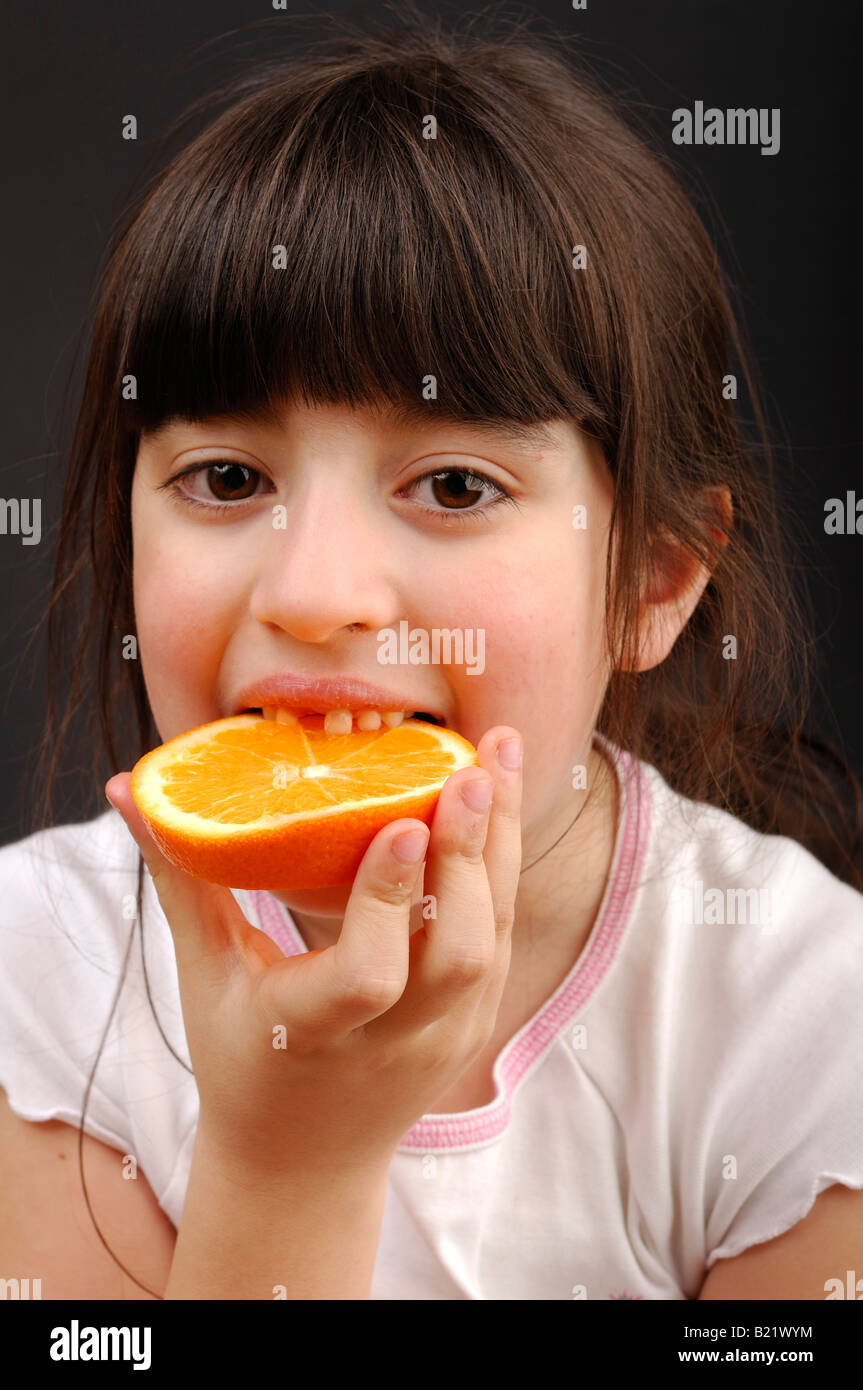 girl with orange Stock Photo - Alamy
