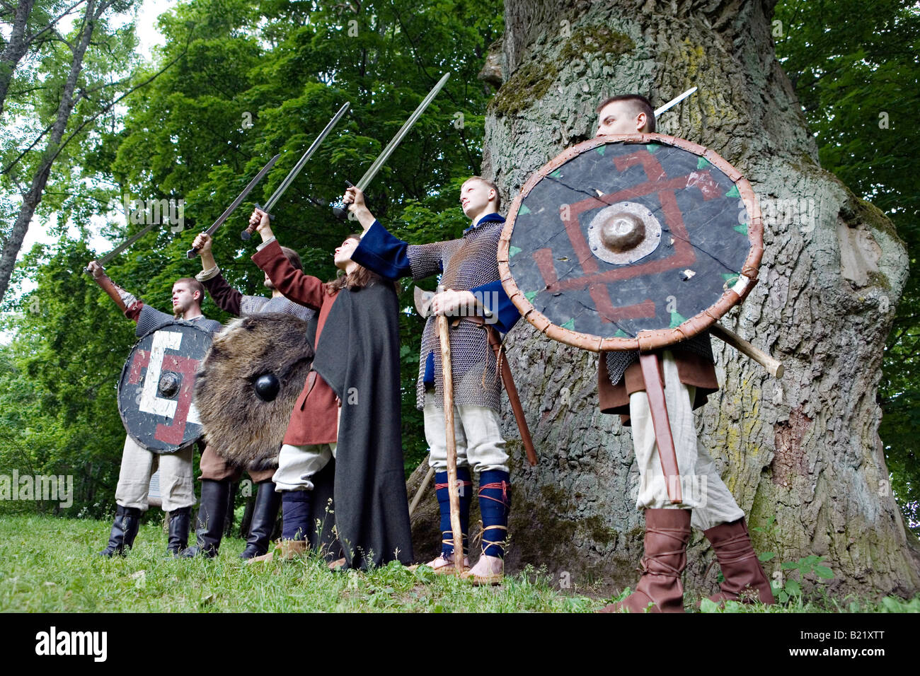 Medieval soldiers standing around an ancient oak tree Stock Photo - Alamy