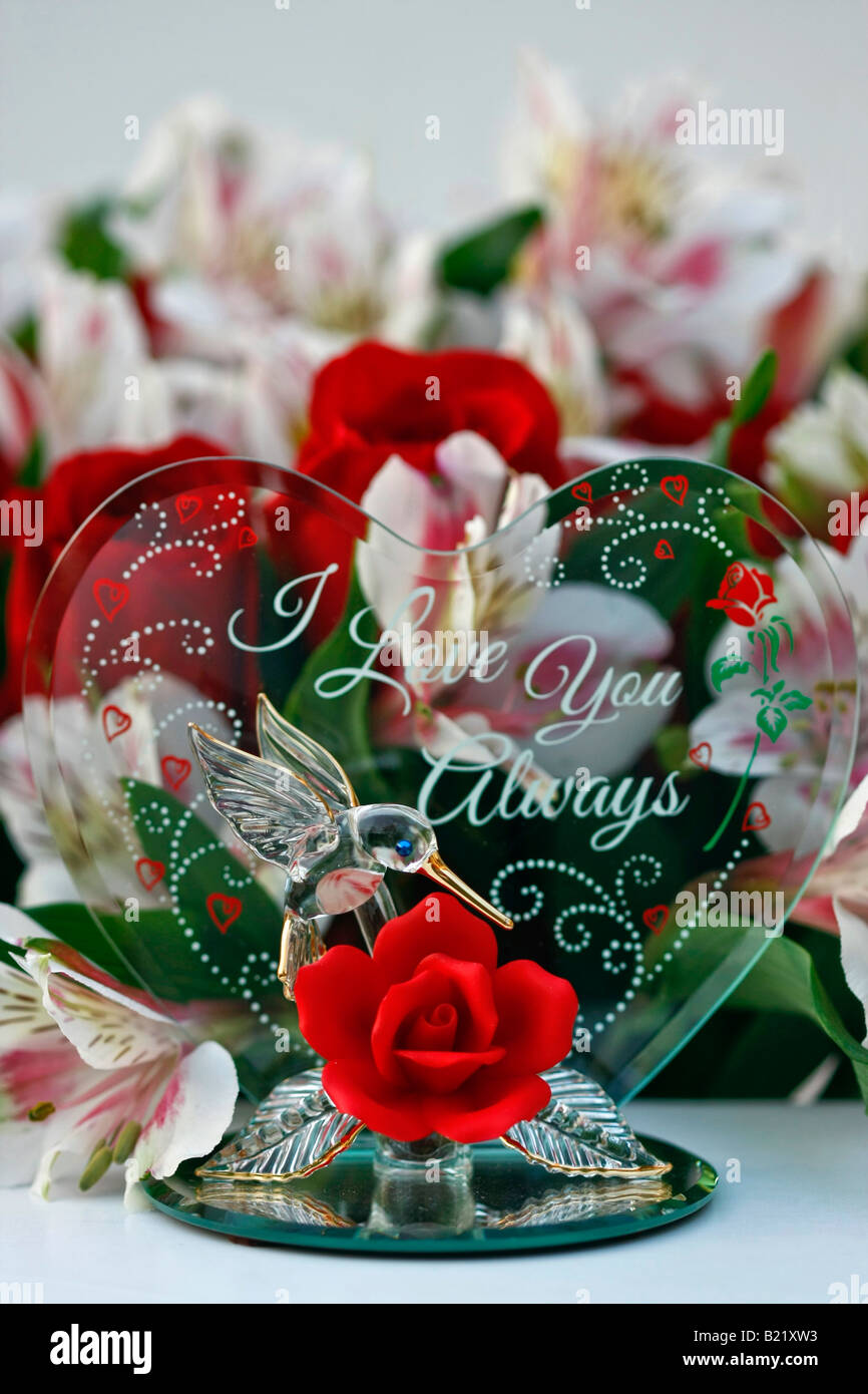 Bouquet of red roses with heart of glass for Valentines Day blurry ...
