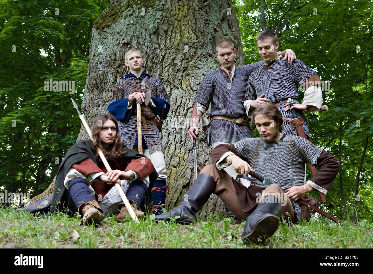 Medieval soldiers resting around ancient oak tree Stock Photo - Alamy