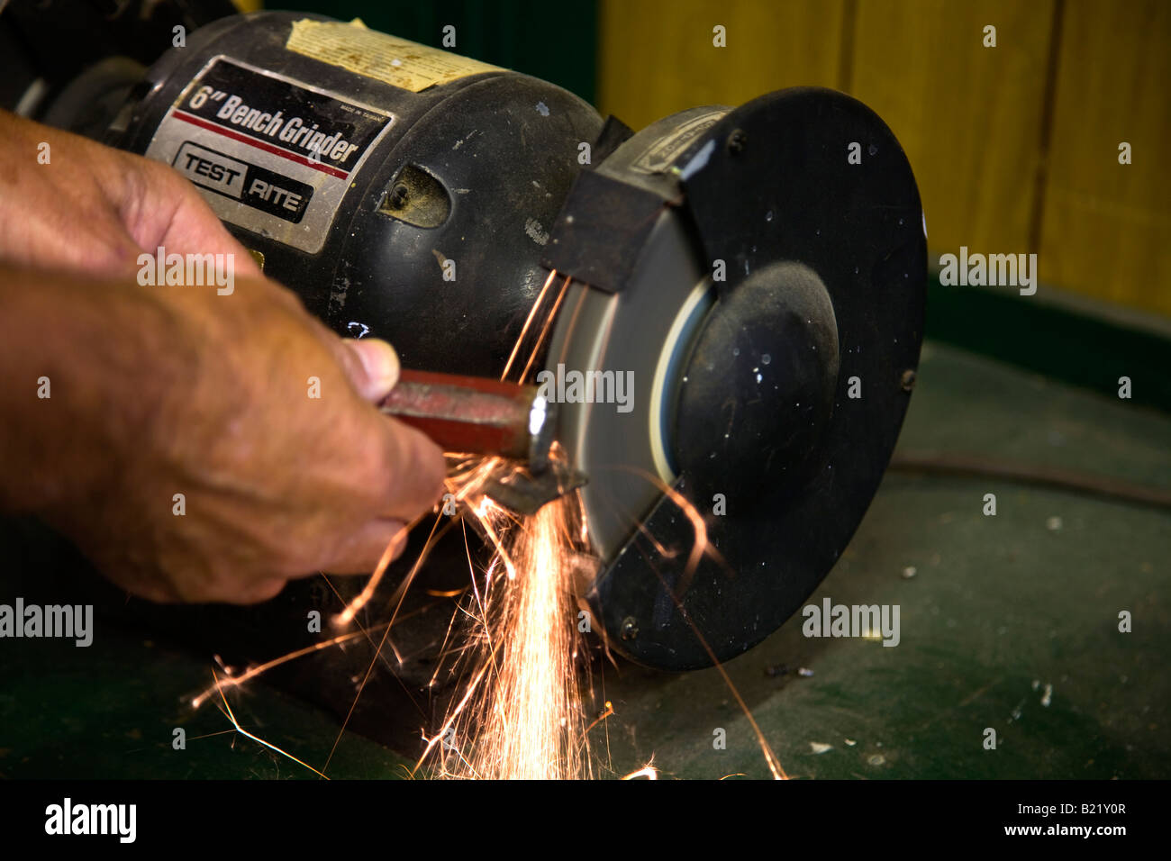 An engineer using a grindstone Stock Photo - Alamy