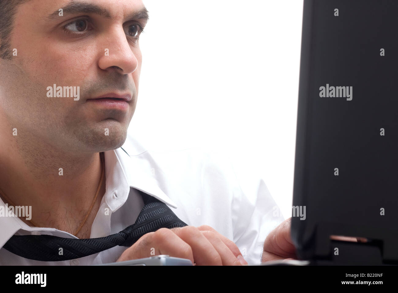 Tireless businessman working in office Stock Photo - Alamy