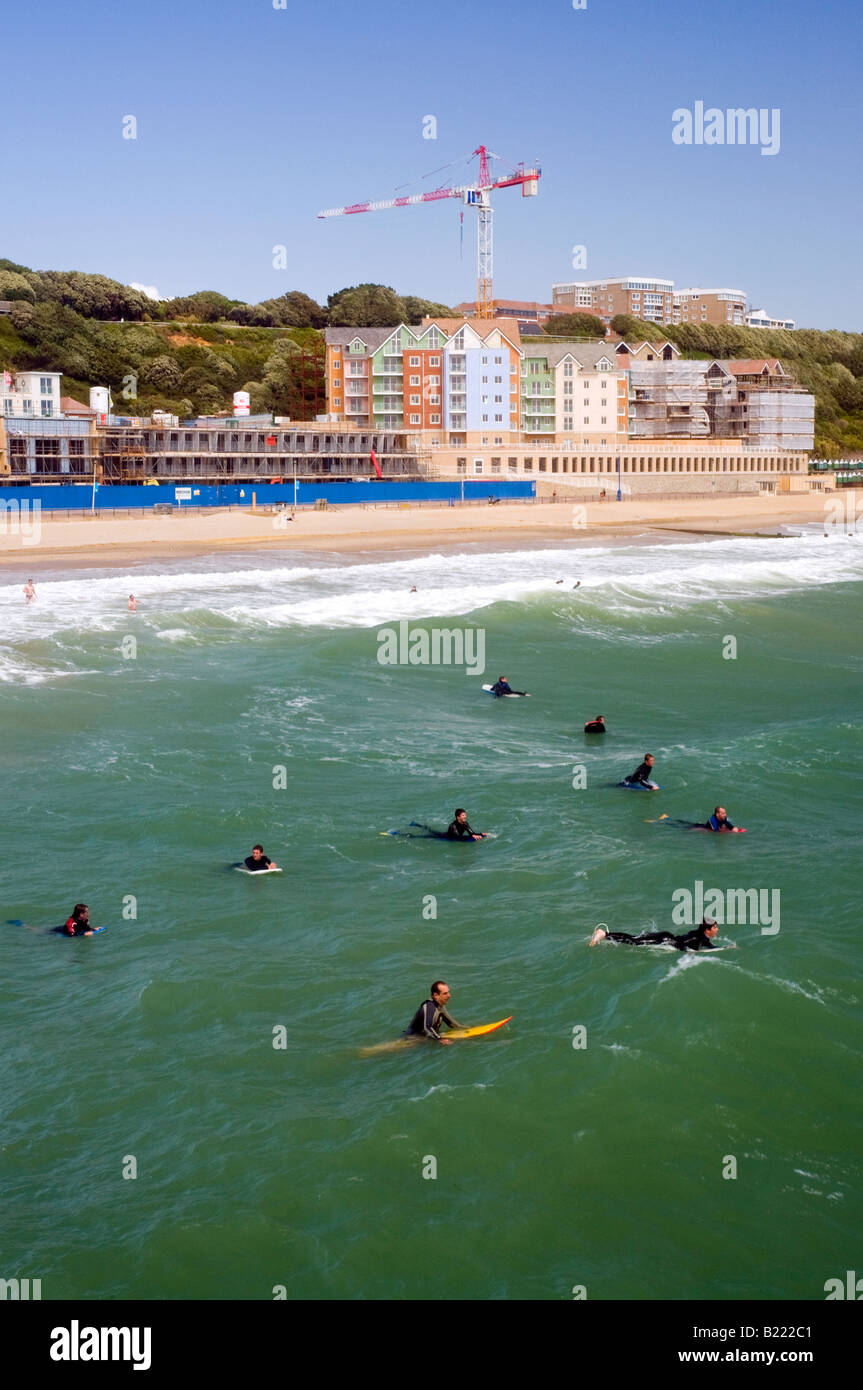 Surfers off Boscombe Spa beach showing the development of luxury ...