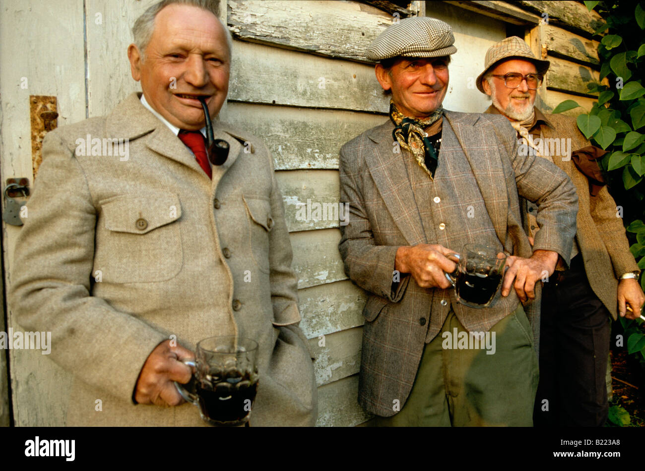 Men in traditional dress drinking beer outside the King s Head Pub ...