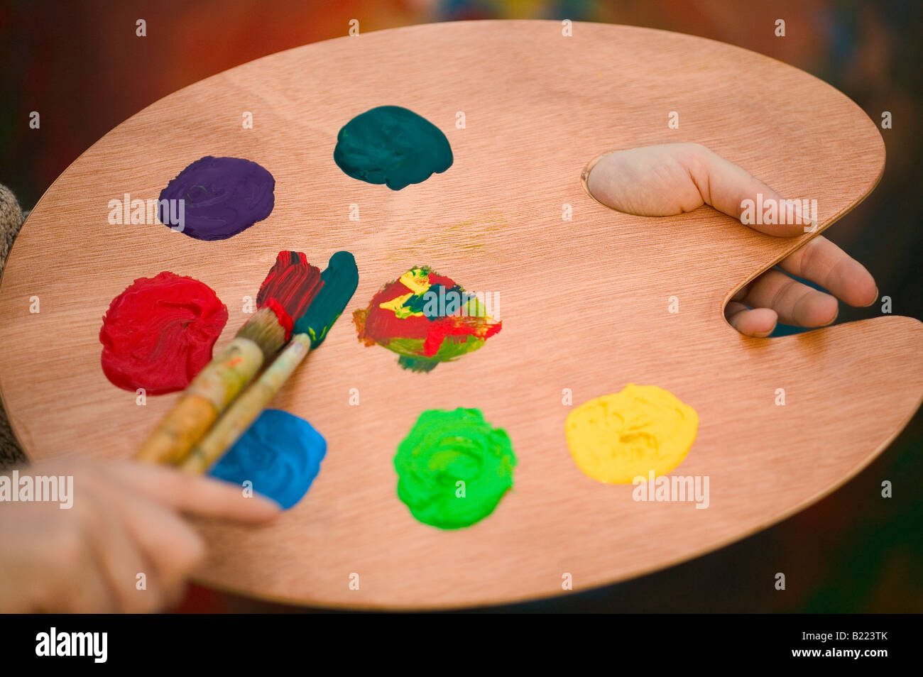palette with colors paint brush hand Stock Photo - Alamy