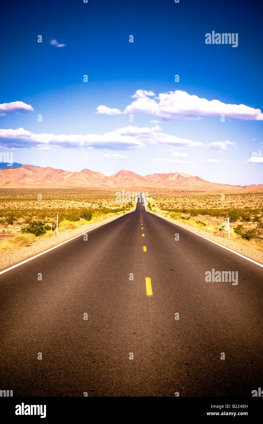 vibrant image of highway and blue sky Stock Photo - Alamy