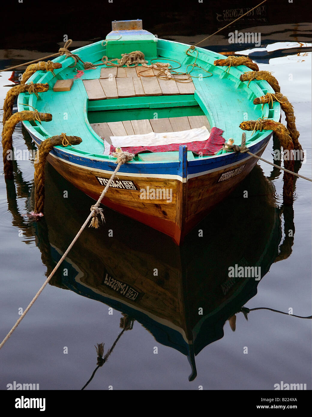 boats tied to shadow Stock Photo - Alamy